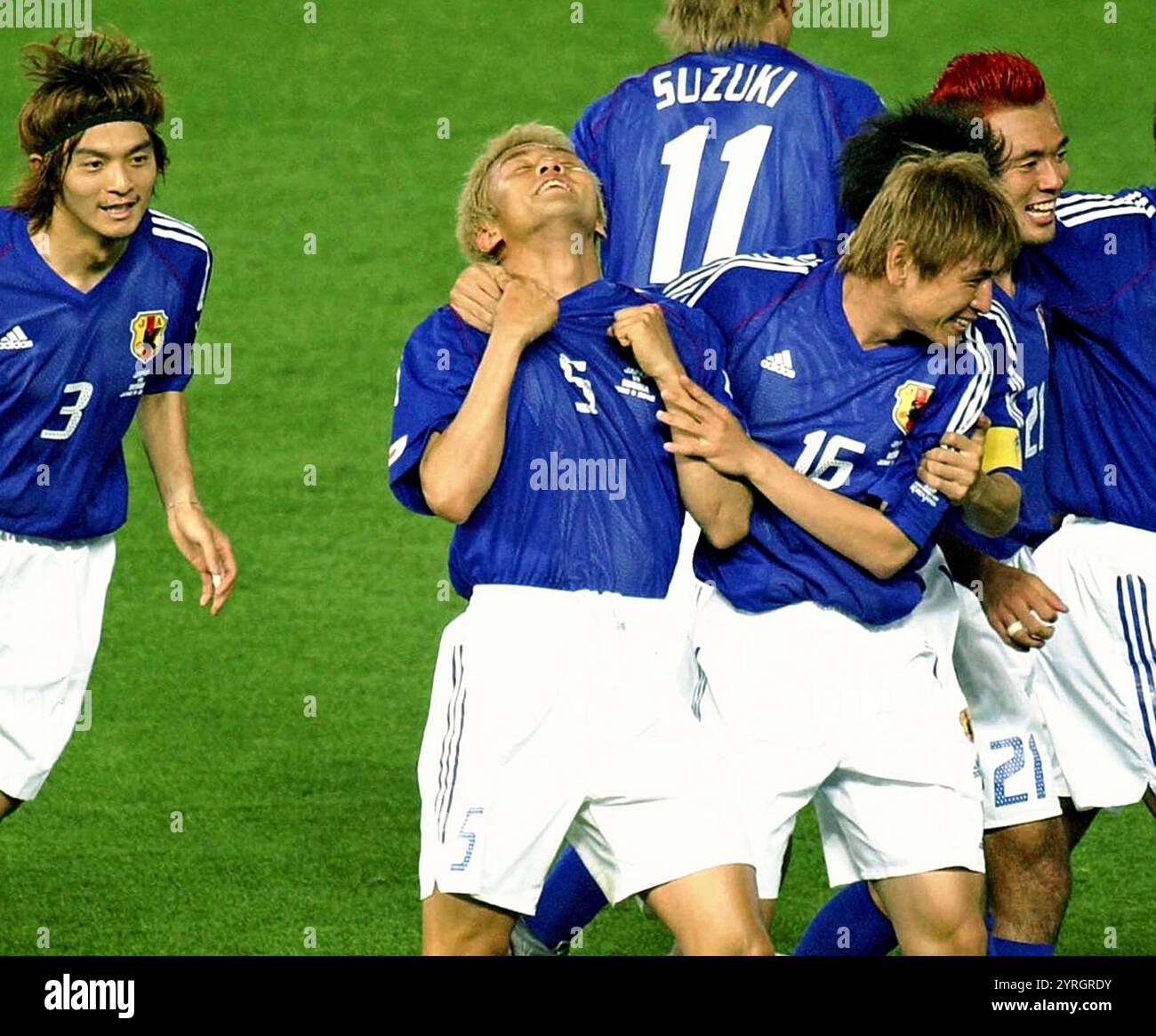 File photo: Junichi Inamoto of Japan (C) celebrates after scoring in ...