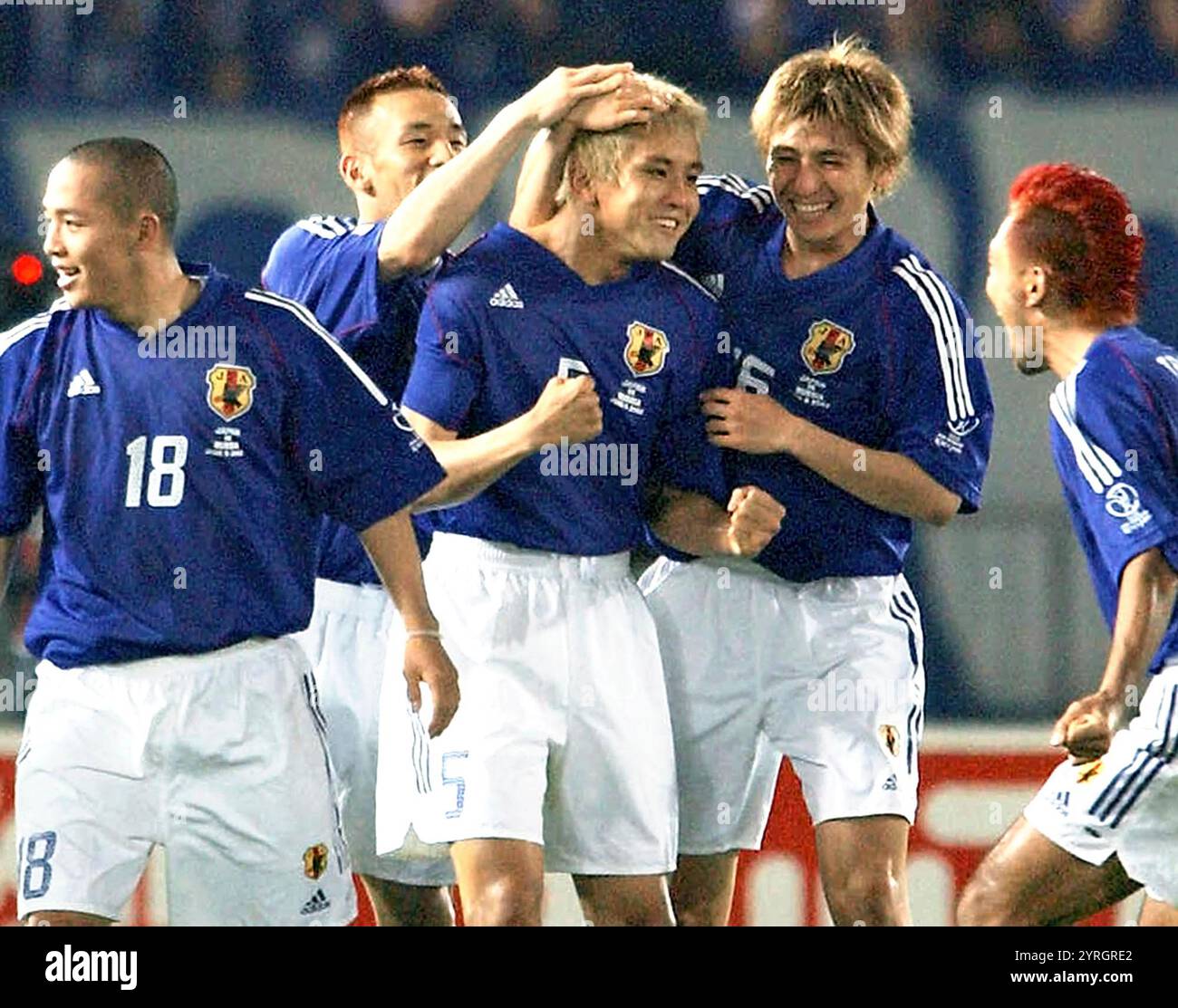 File photo: Junichi Inamoto of Japan (C) celebrates after scoring in ...