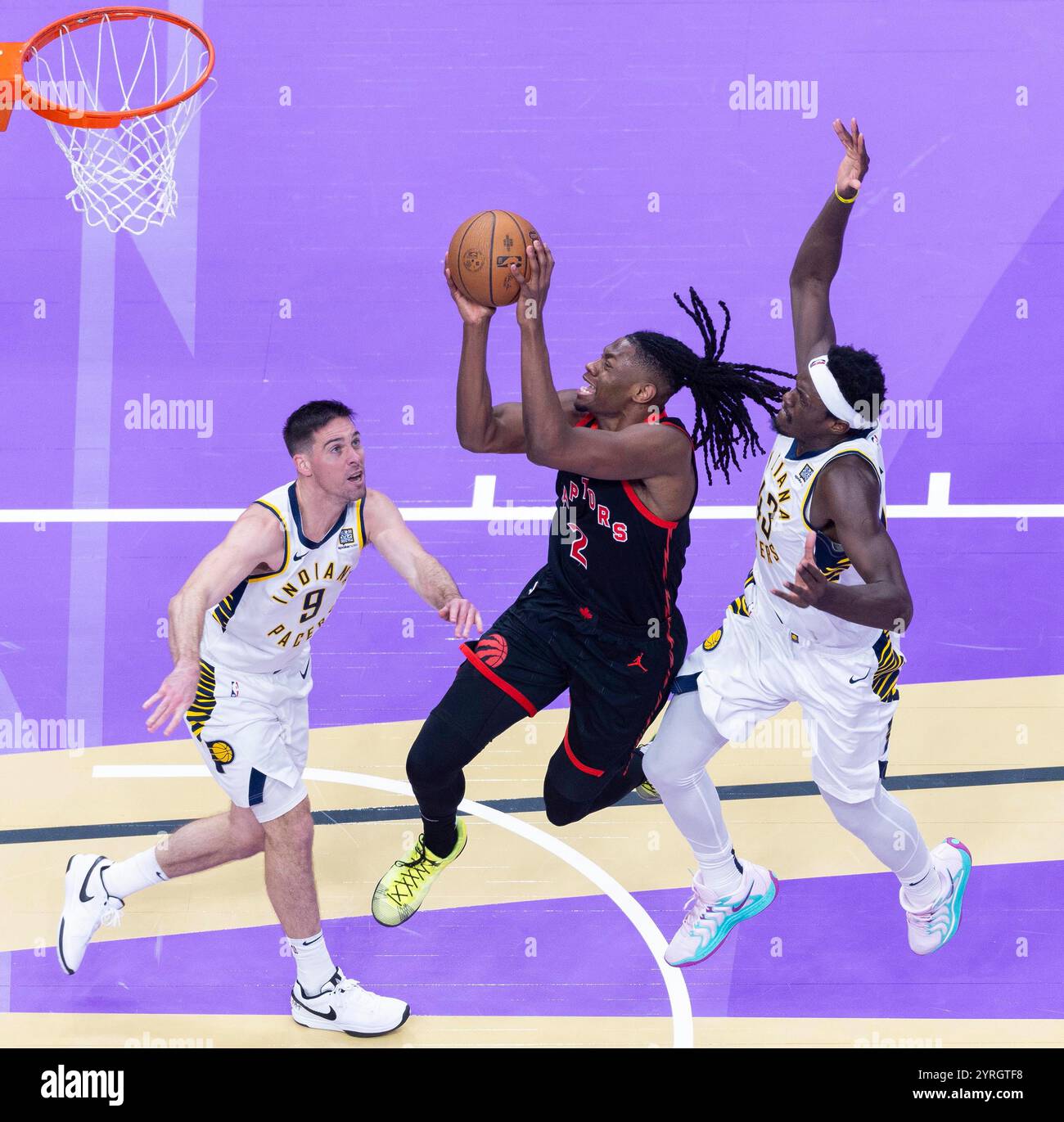 Toronto, Canada. 3rd Dec, 2024. Jonathan Mogbo (C) of Toronto Raptors ...