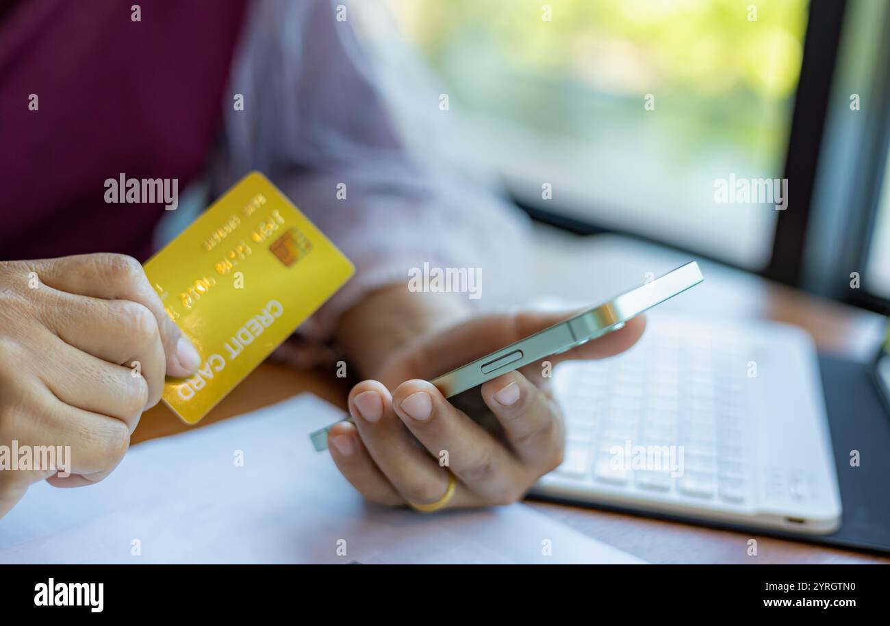 Online banking transaction concept, Woman with credit card using smart phone and shopping online ...