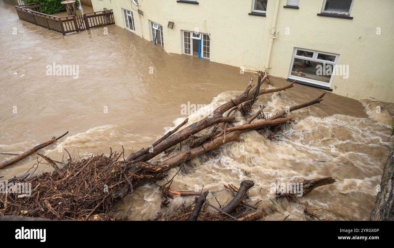 River Cothi breaking it banks and flooding a riverside building on the ...
