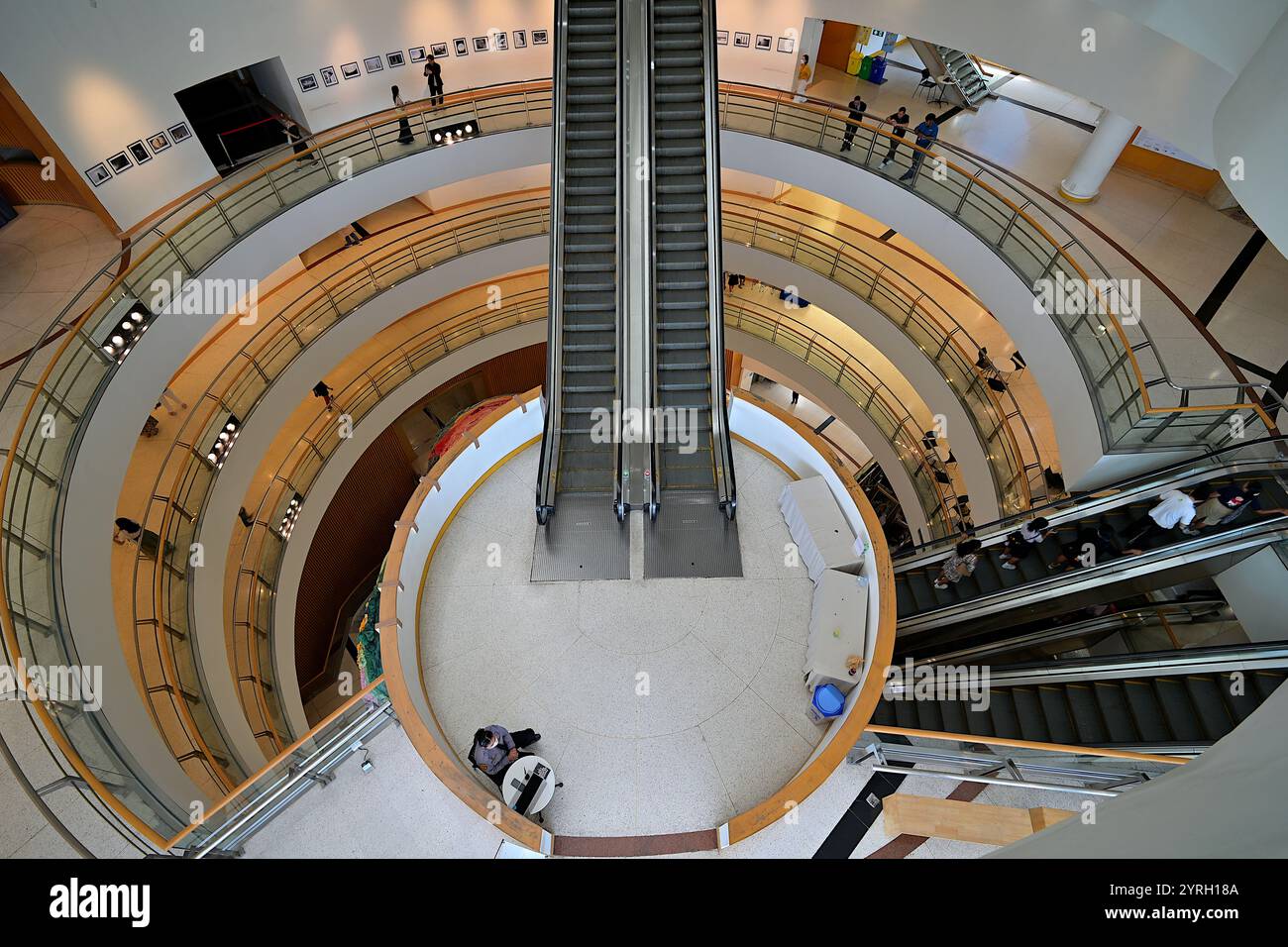 View of spacious circular walkways around the airy central atrium of ...