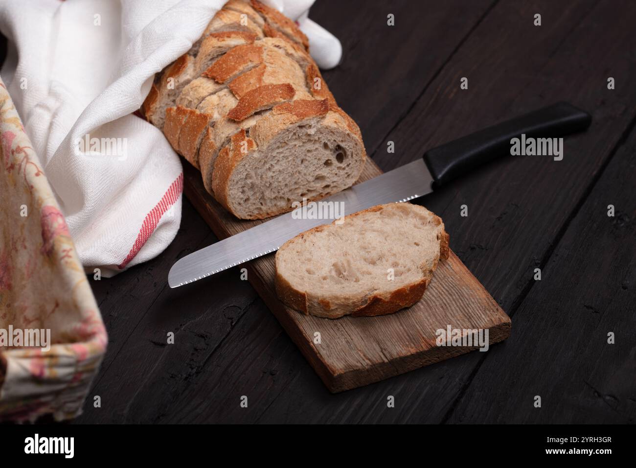 Rustic Bread Display with Sliced Whole Grain Loaf in Wicker Basket on ...