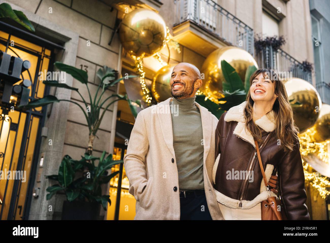 Cheerful couple strolls through hi-res stock photography and images - Alamy