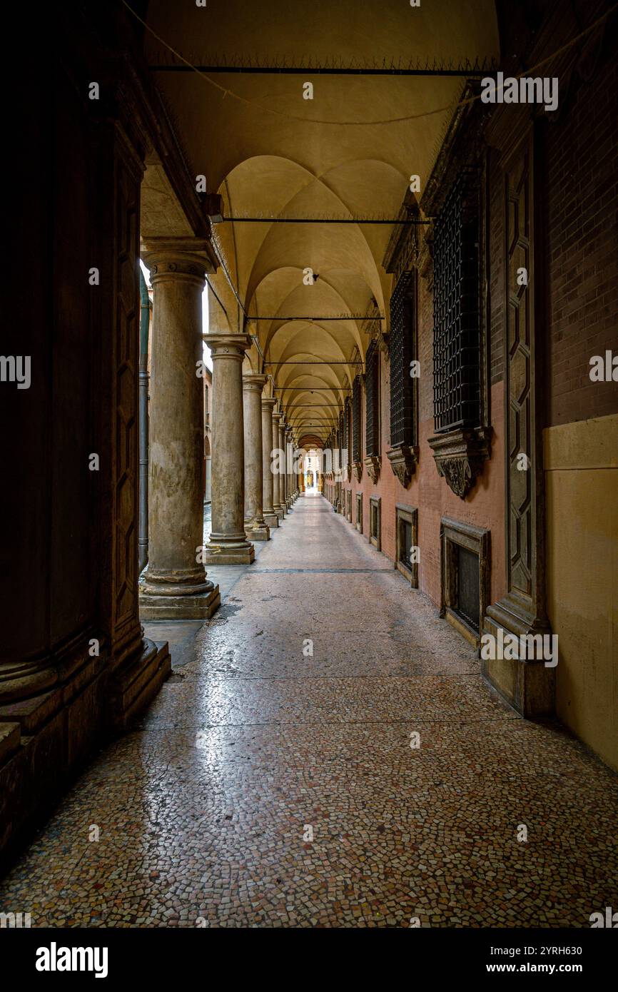 Long corridor with columns and vaulted ceiling in bologna, italy ...