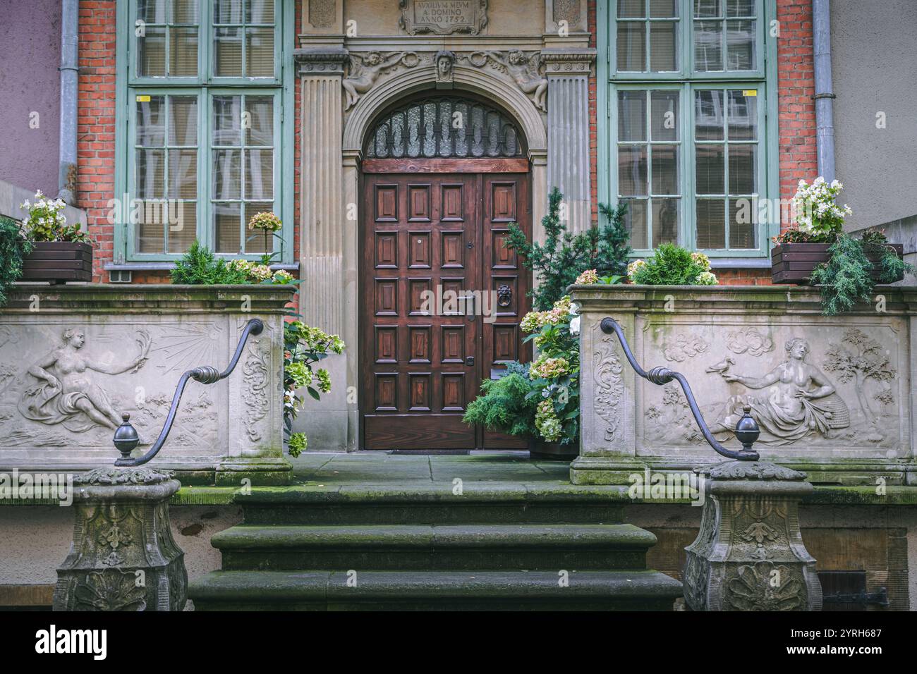 Elegant building in gdansk, poland, showcases ornate stone railings, a ...