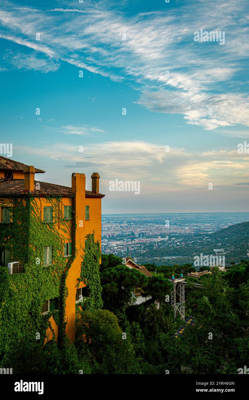Panoramic view of barcelona from mount tibidabo at sunset with a ...