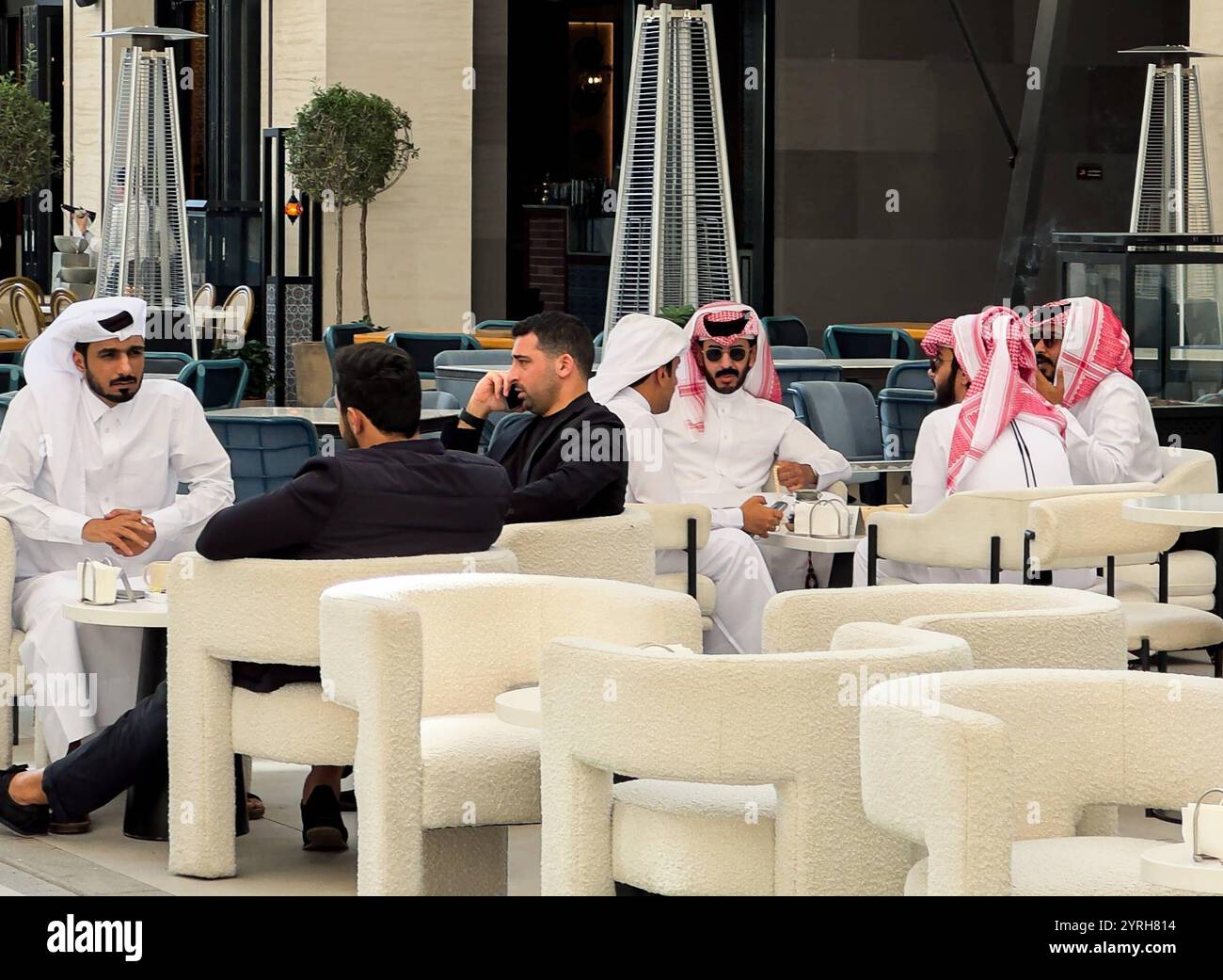 WINTER WEATHER IN DOHA, People sit outside a cafe in Downtown in the ...