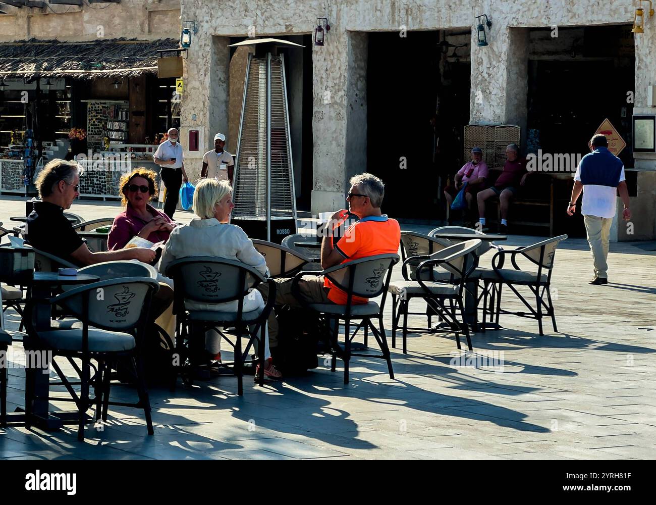 WINTER WEATHER IN DOHA, People sit outside a cafe in Downtown in the ...