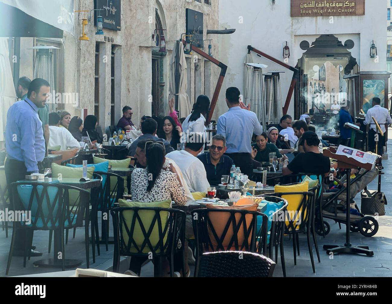 WINTER WEATHER IN DOHA, People sit outside a cafe in Downtown in the ...