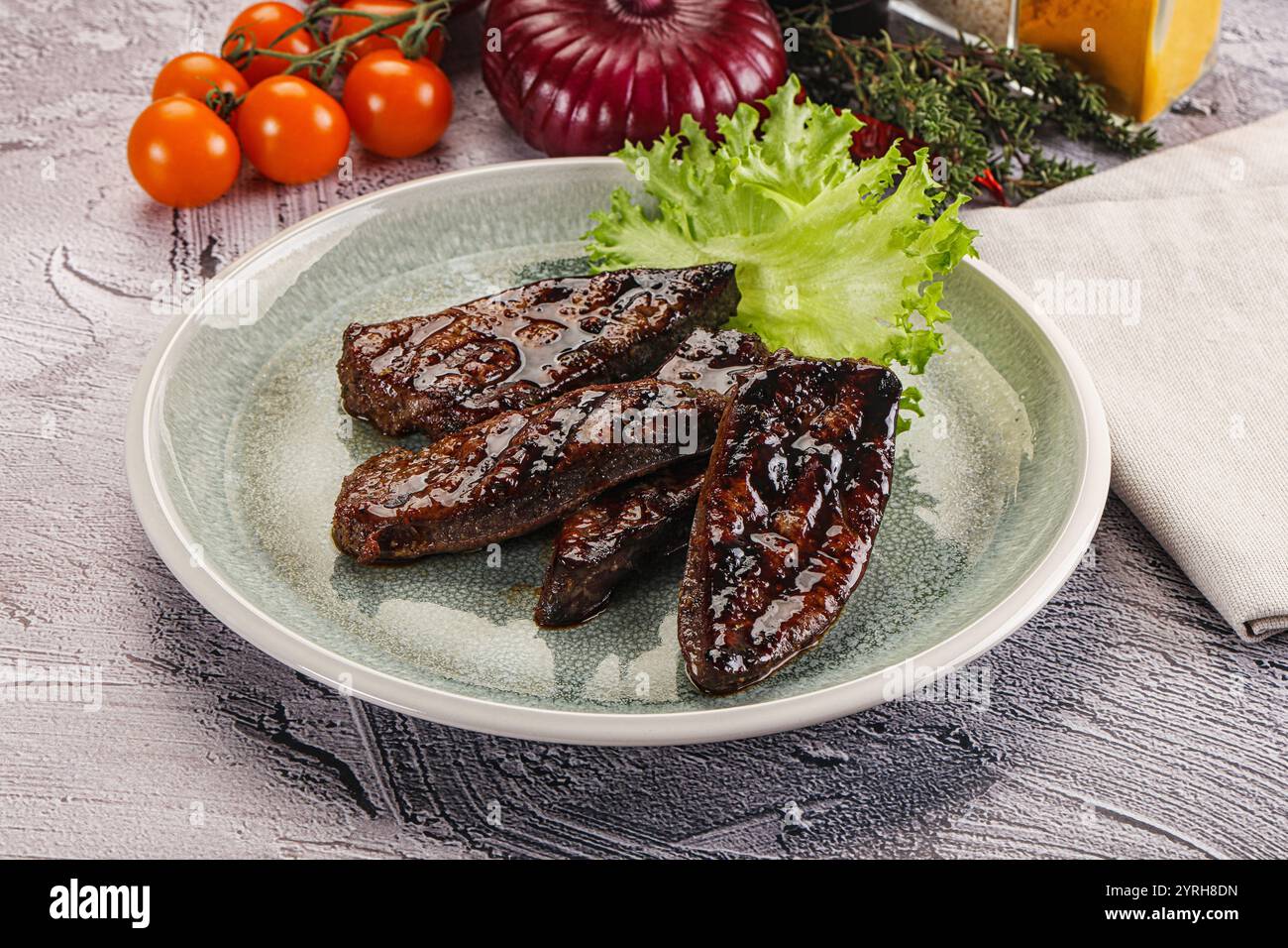 Grilled diet beef liver steak in the plate Stock Photo - Alamy
