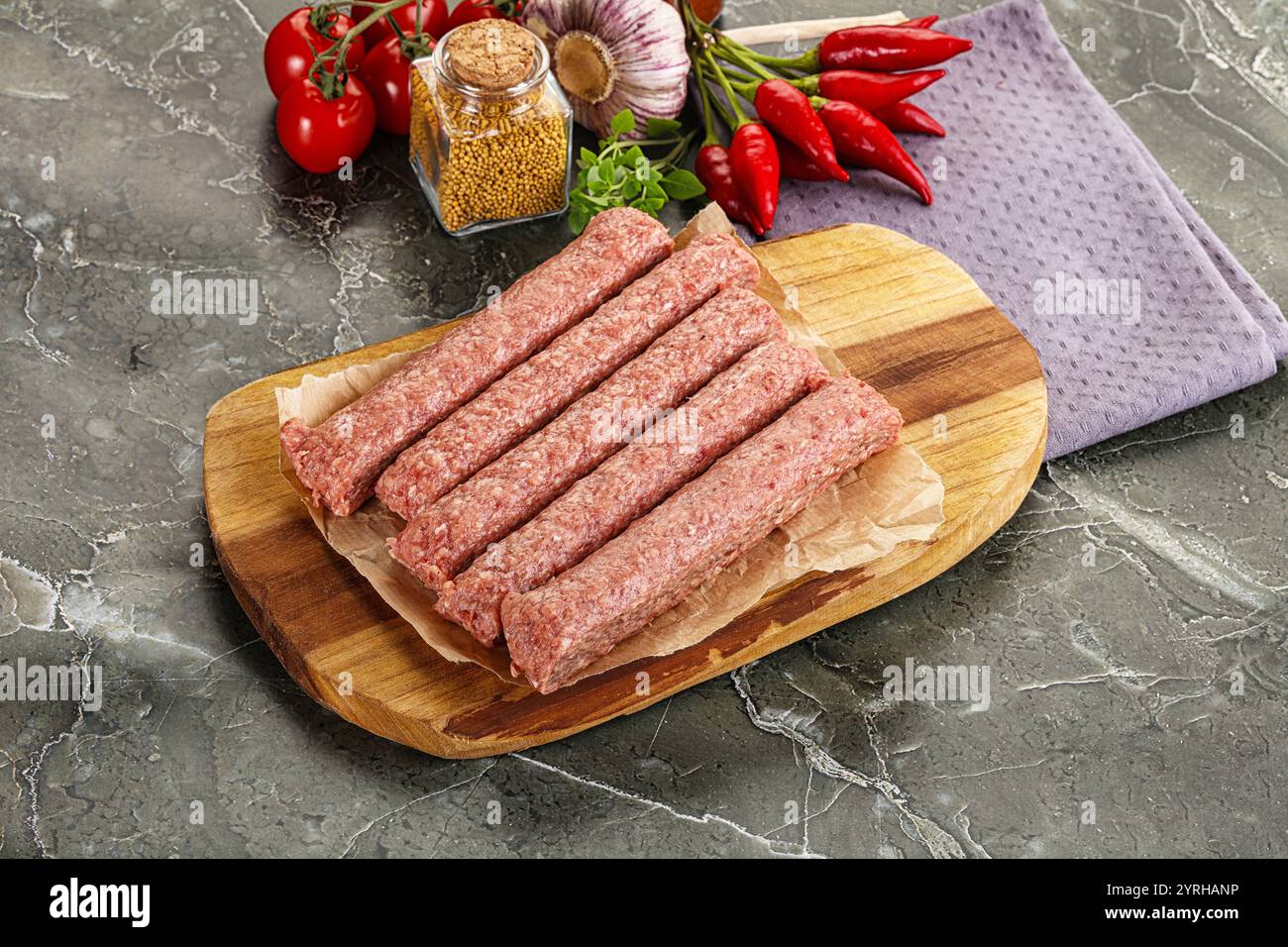 Raw beef uncooked kebab sausage for grill Stock Photo - Alamy