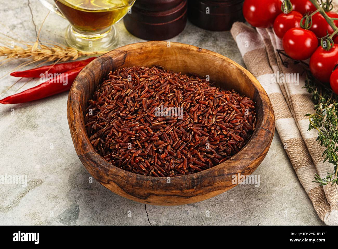 Red raw dry rice grain gor cooking Stock Photo - Alamy