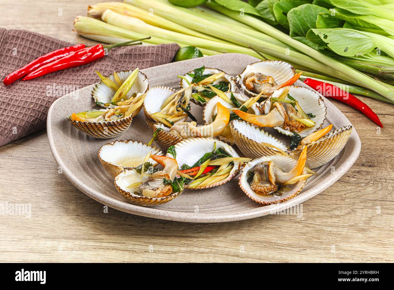 Delicous Asian mollusk shell steamed with spices Stock Photo - Alamy