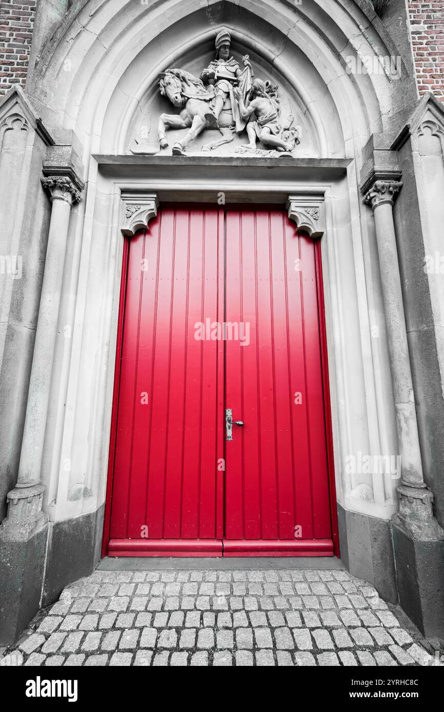 Bright red door at the black and white entrance area. Old entrance to a church Stock Photo - Alamy