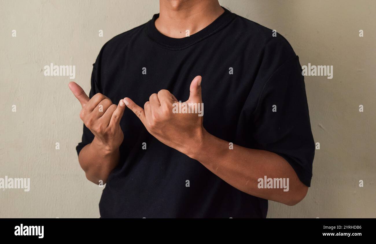 Young man hand gesture about stop sign language to teaching or assist ...