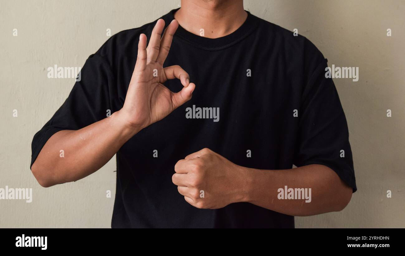 Young man showing sign language gesture during online lesson Stock ...