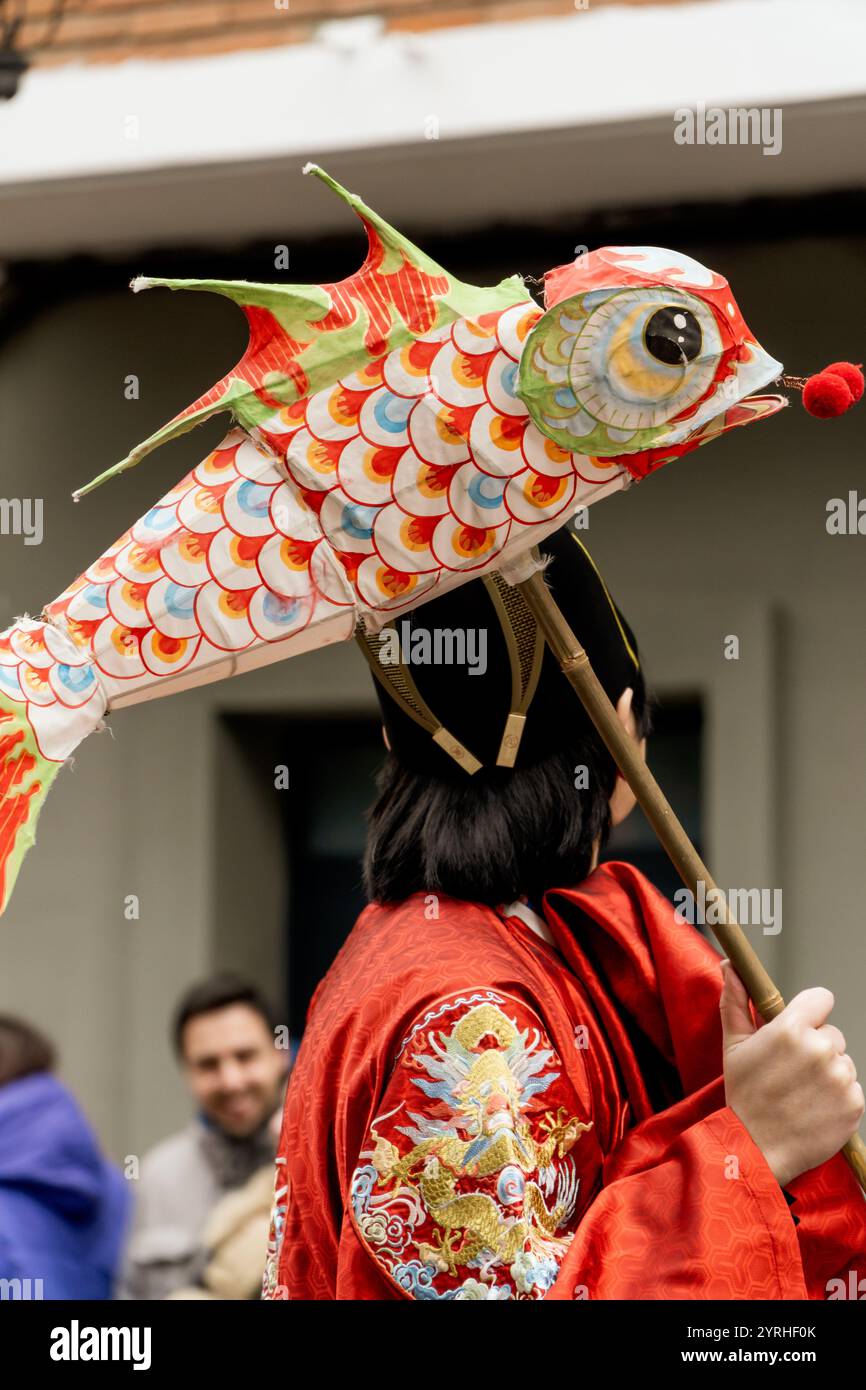 Unrecognizable Chinese man on traditional clothing handling prosperity ...