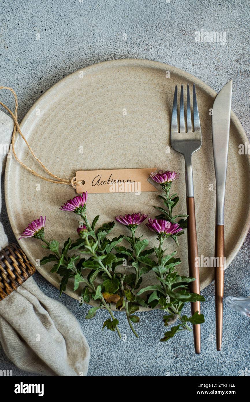 Elegant table setting featuring a beige plate adorned with a floral ...