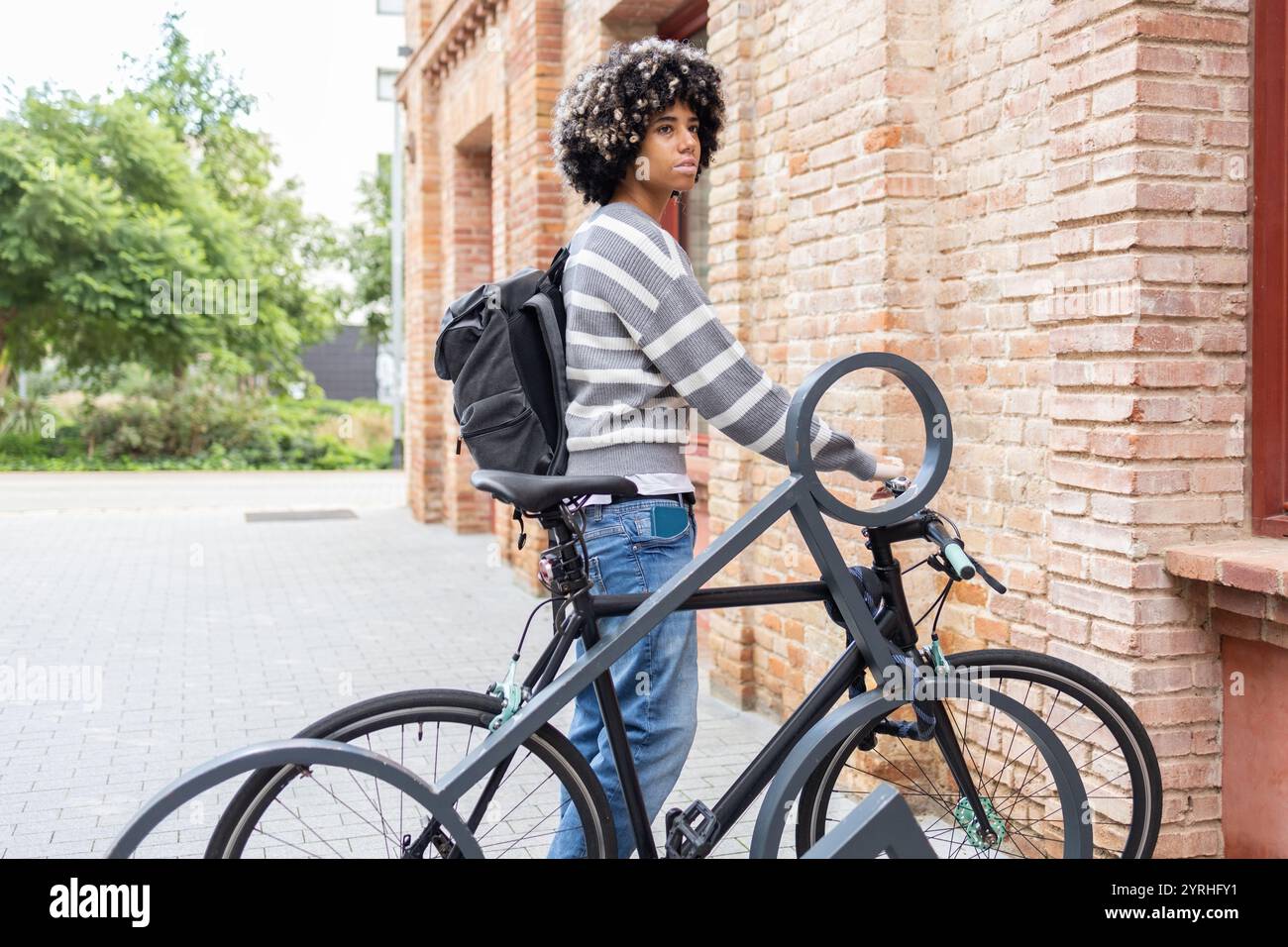 A mixed race woman with vitiligo enjoys a relaxing day at university ...