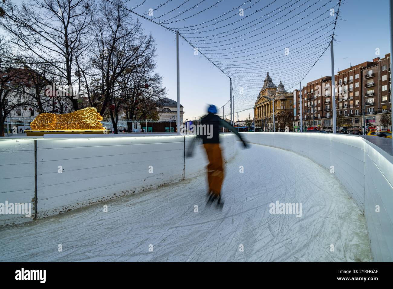 ice skating in a public ice skate ring in Budapest. Blurry movement ...