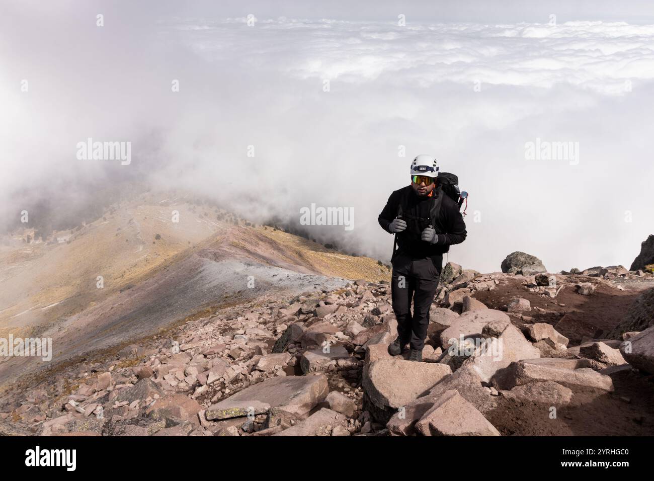 A determined hiker ascends the rocky trail of La Malinche volcano ...