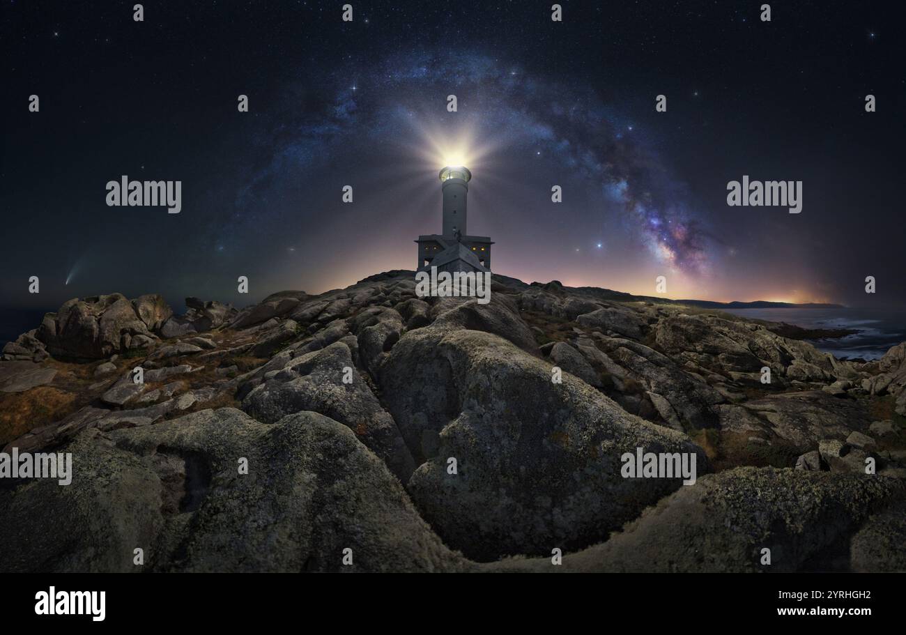 A stunning lighthouse beams atop a rocky hill under a mesmerizing Milky ...