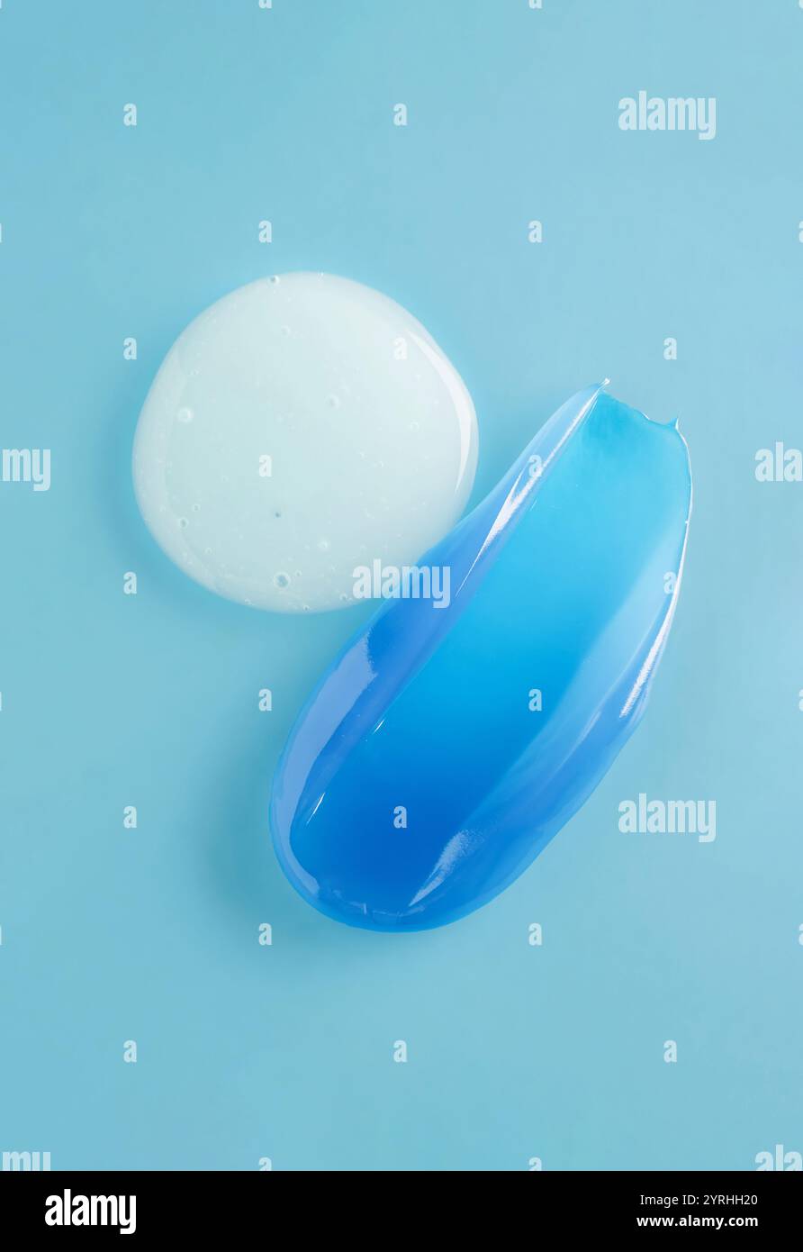 Aesthetic display of vibrant blue cosmetic textures on a sleek aqua ...