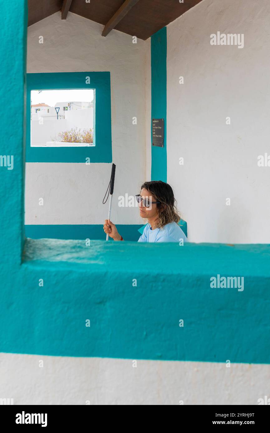 A woman, both deaf and blind, confidently navigates daily life using a ...