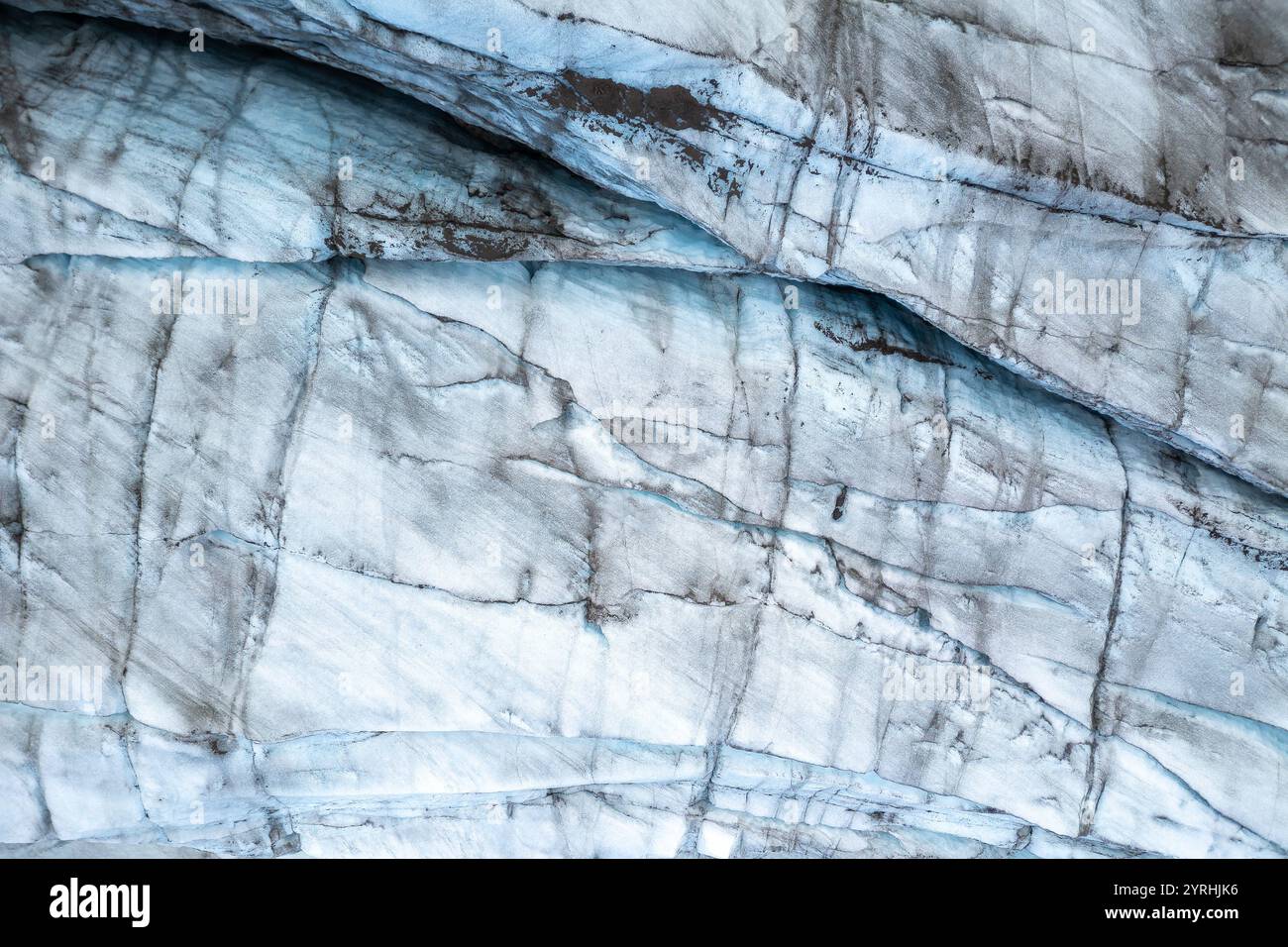Explore the intricacies of a glacier surface, revealing icy textures ...