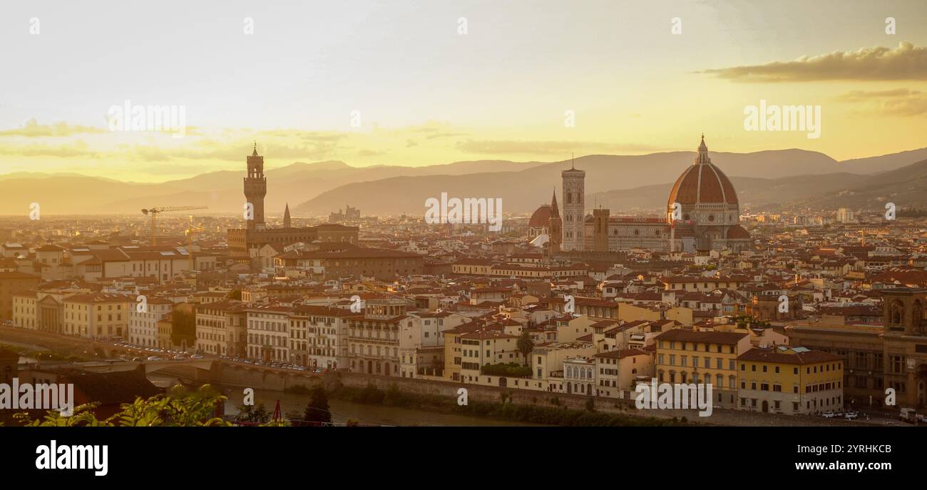 Panoramic view of Florence at sunset, showcasing the city's historic skyline with iconic ...