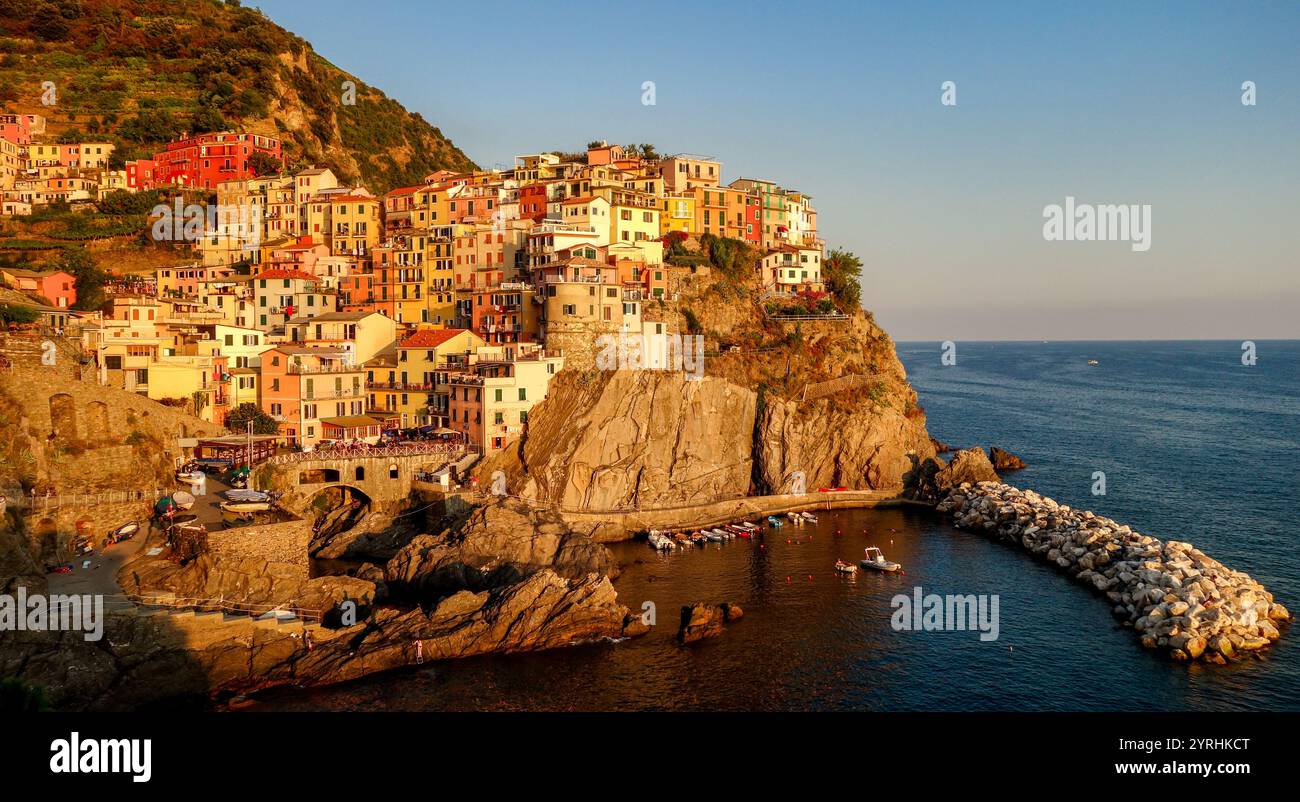 A stunning view of a colorful Italian coastal village at sunset ...