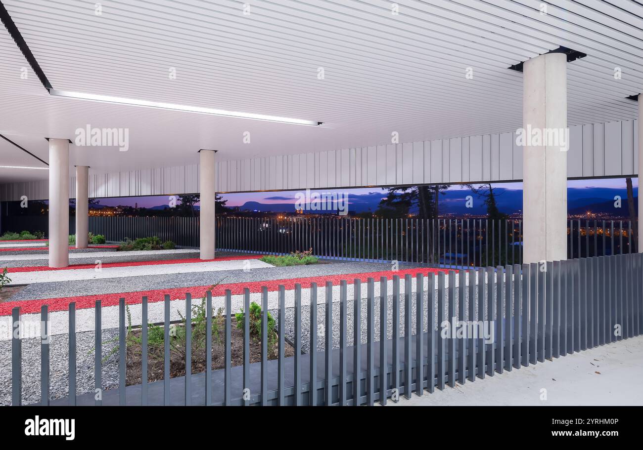 This image captures the modern entrance of a hospital center ...