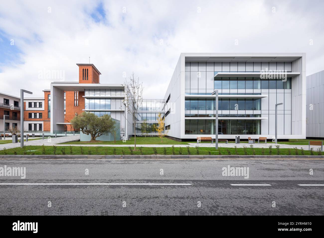 A modern hospital building featuring a blend of brick and glass ...