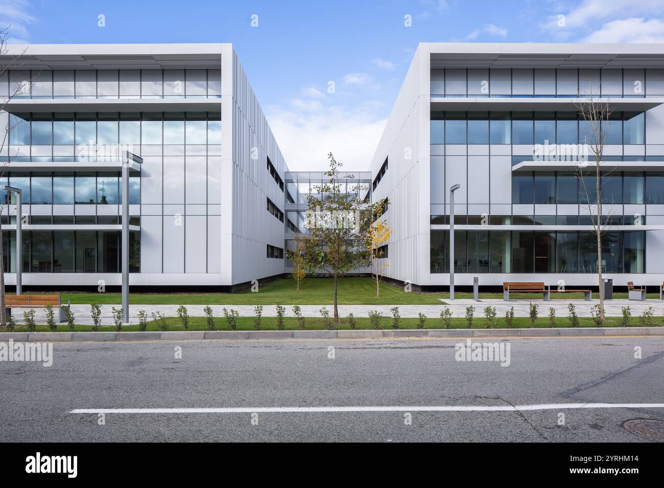A modern hospital center with a sleek design, featuring glass facades ...