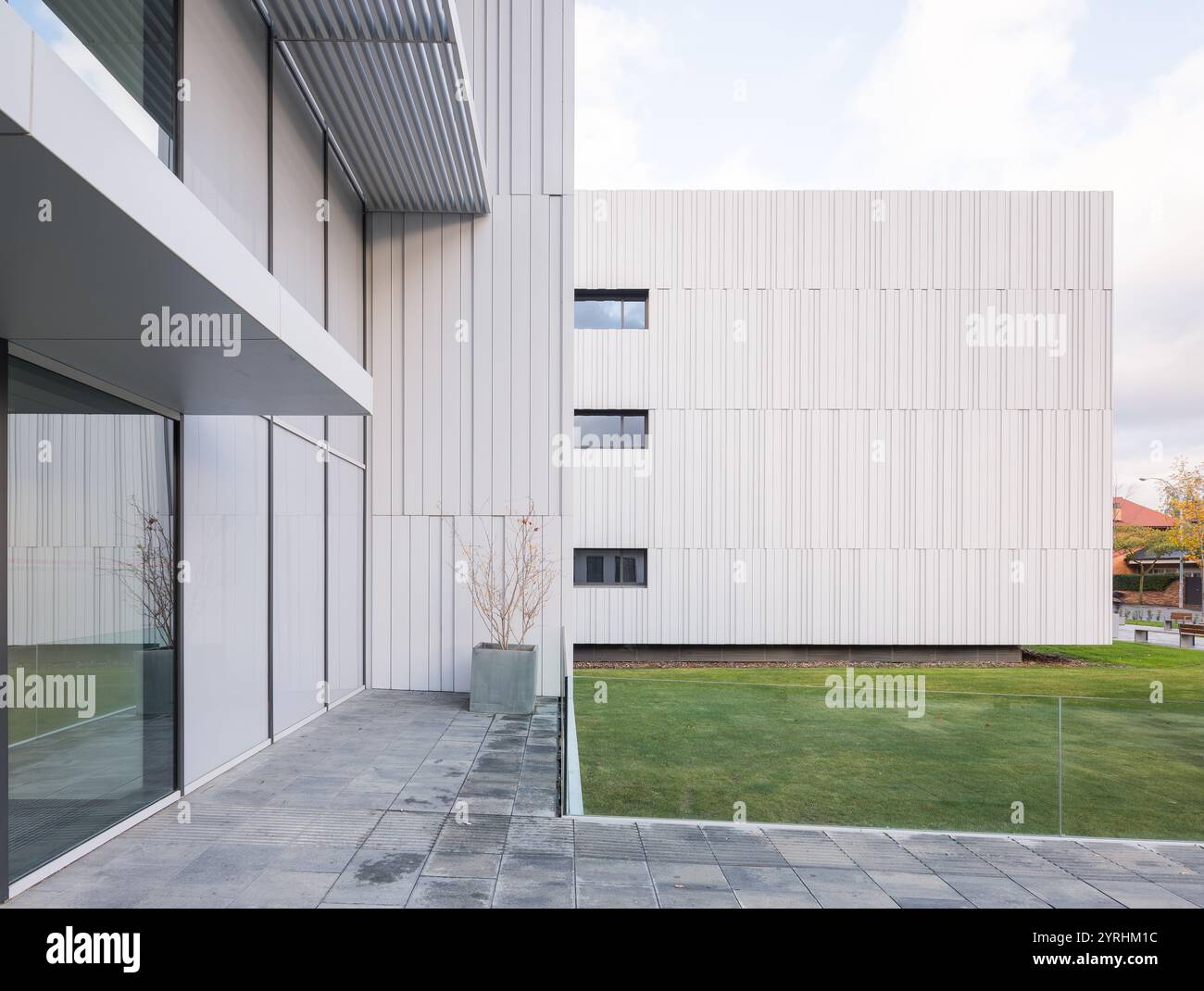 A modern hospital center features sleek, white walls and expansive ...