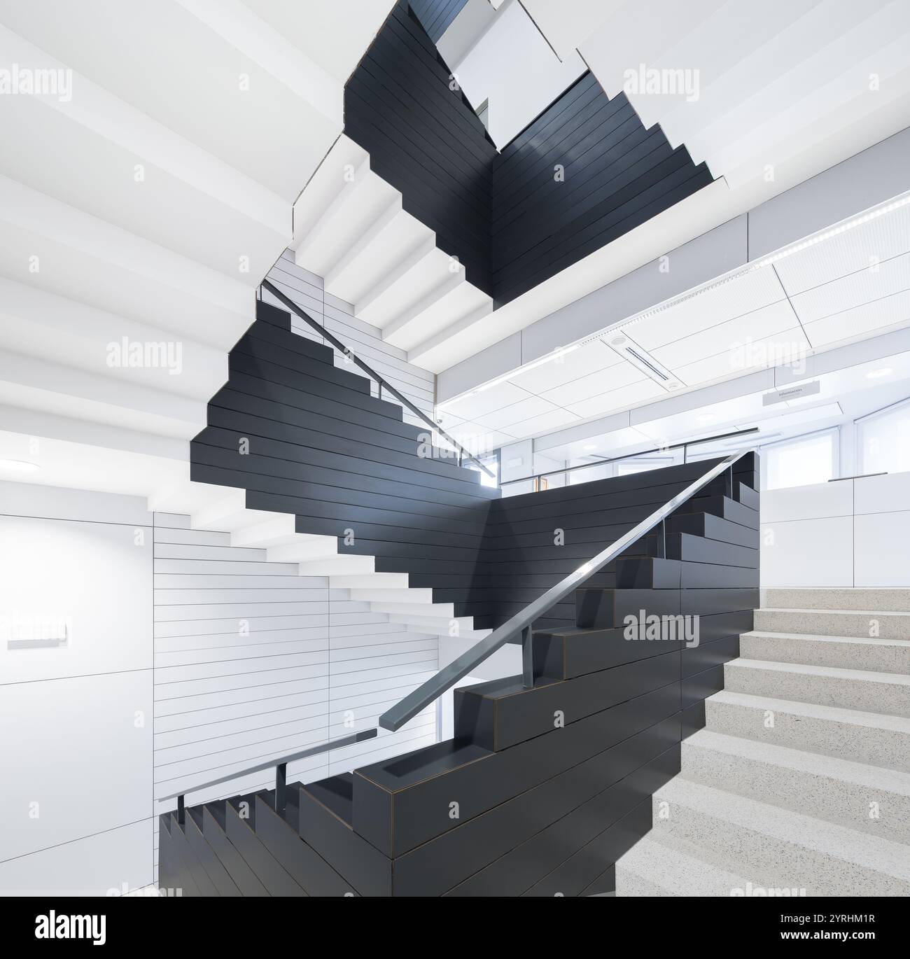 A sleek, modern hospital interior showcasing a striking staircase ...