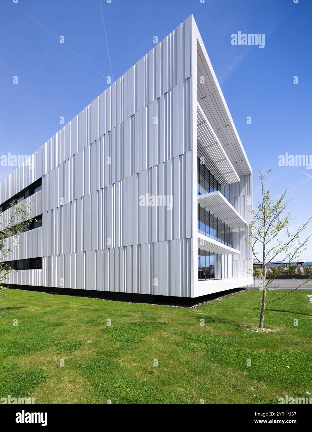 The photo showcases a contemporary hospital building with a sleek ...