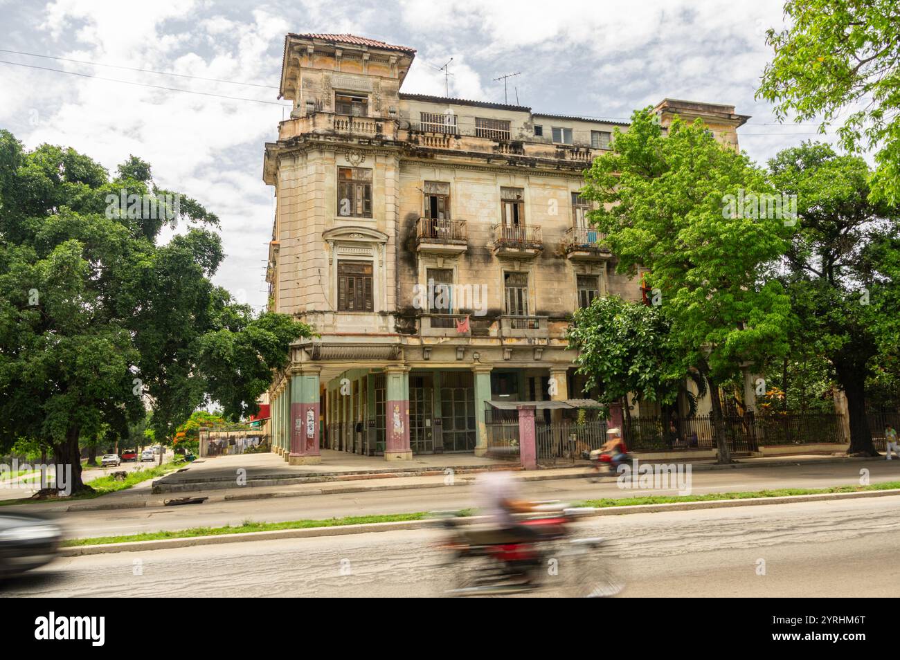 An elegant, abandoned historic building with ornate details stands ...