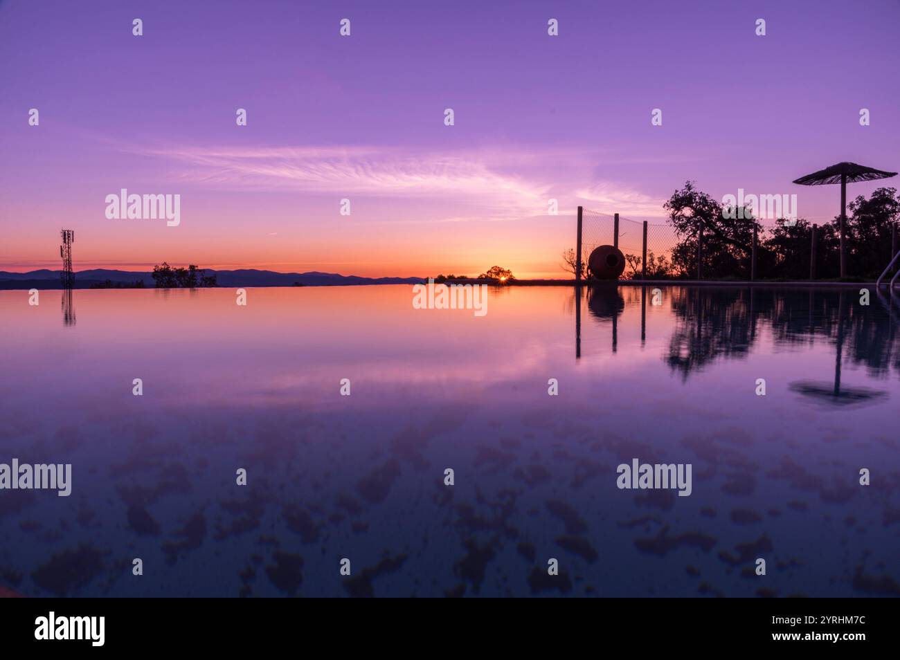 Tranquil natural pool scene at dusk, capturing serene reflections of a ...
