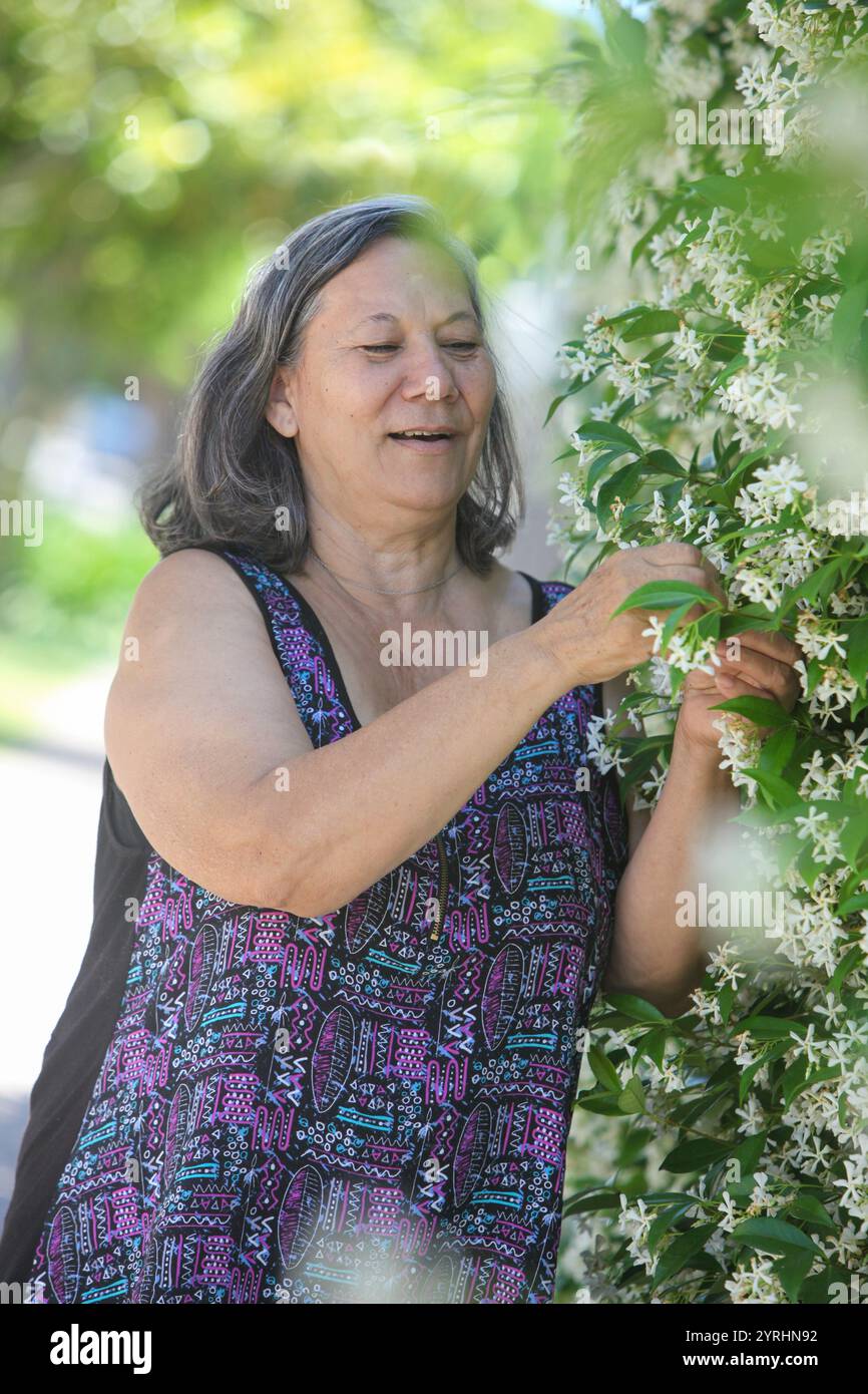 portrait of senior south America native woman in her garden by her ...