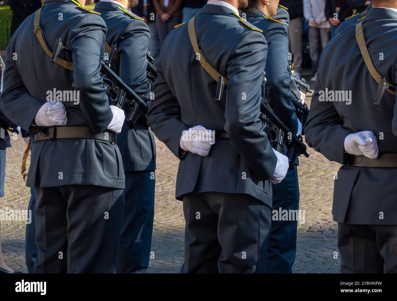 Italian soldiers in uniform during ceremony, hands clasped with white ...