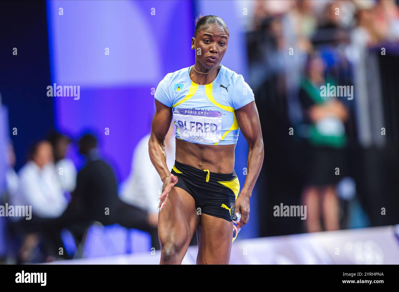 Julien Alfred participating in the 200 meters relay at the Paris 2024 ...