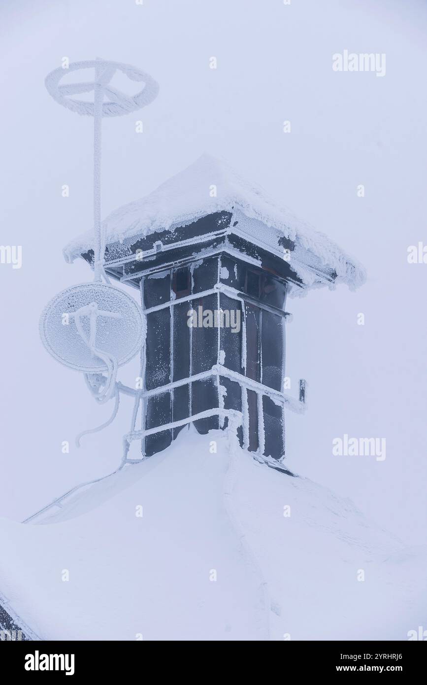 Cold winter detail, heavy snow on house chimney at rural area. Frozen ...