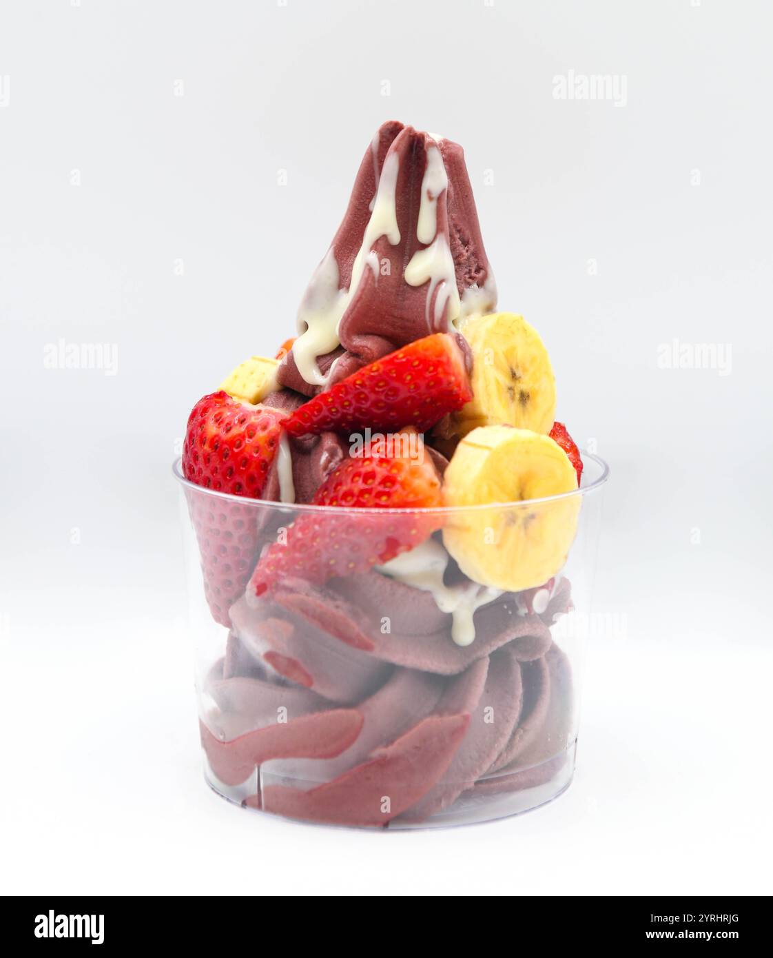 Yogurt and acai ice cream with chopped fruit pieces Stock Photo - Alamy