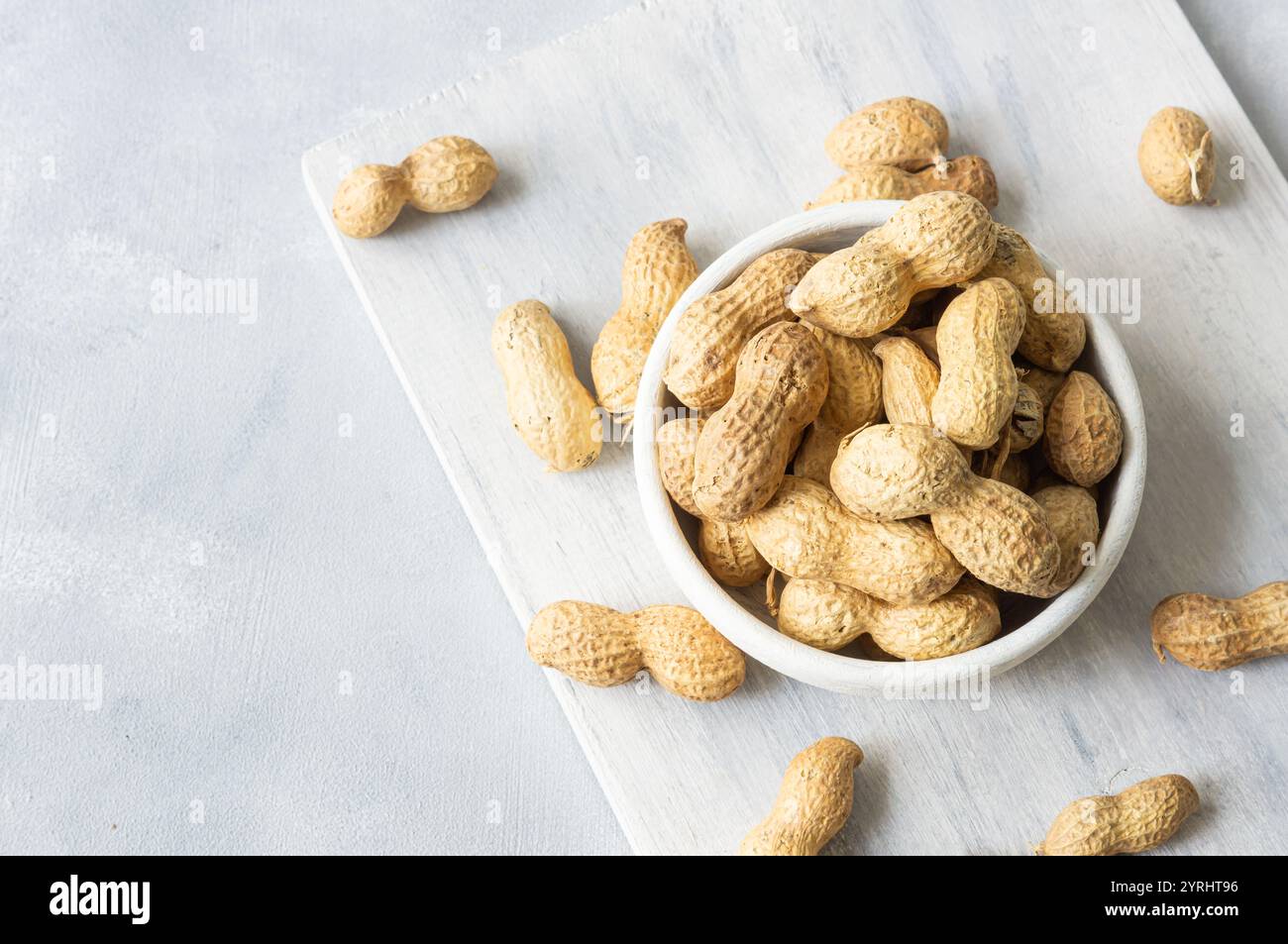 Peanut with nutshell not peeled nut on rustic background, composition ...