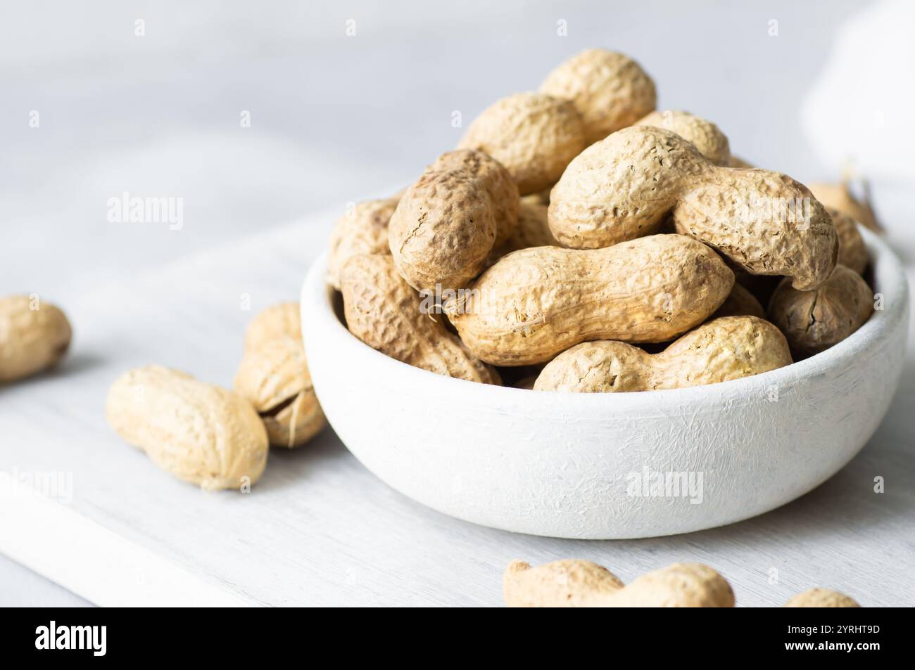 Peanut with nutshell not peeled nut on rustic background, composition ...