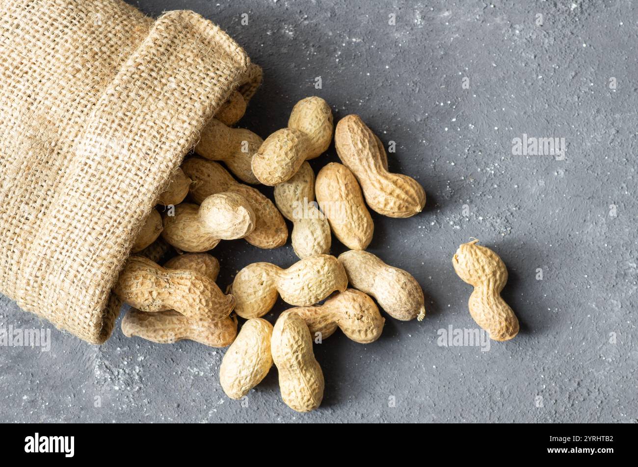 Peanut with nutshell not peeled nut on rustic background, composition ...