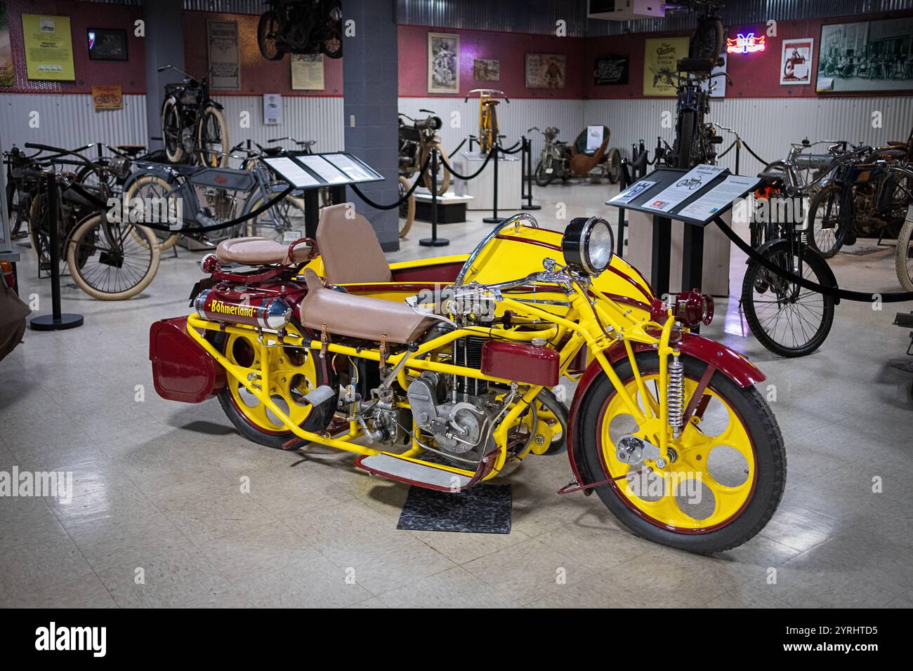 A 1936 yellow & burgundy Bohmerland touring motorcycle with a sidecar ...