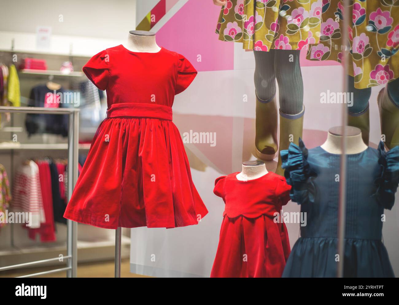 Mannequins of children's clothing on display in a store Stock Photo - Alamy